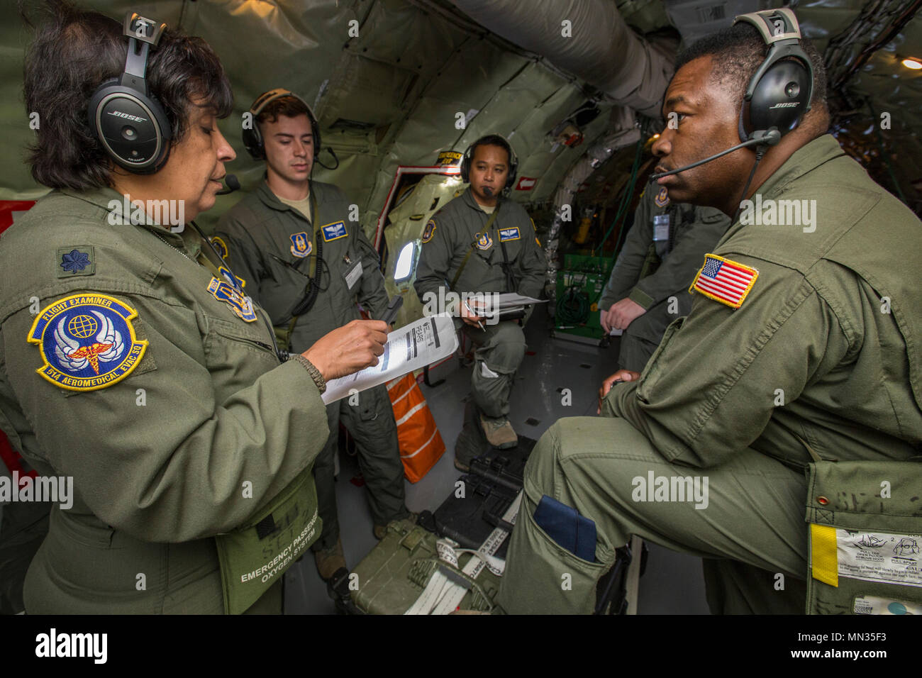 U.S. Air Force Lt. Col. Rosa M. Ramos, left, Flight Examiner, discusses ...