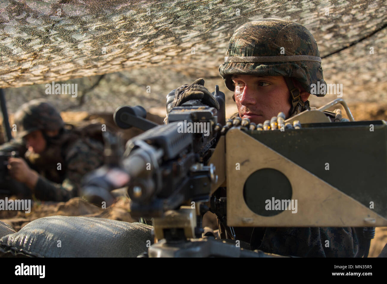 U.S. Marines from Marine Wing Support Detachment (MWSD) 31, load a M240 ...