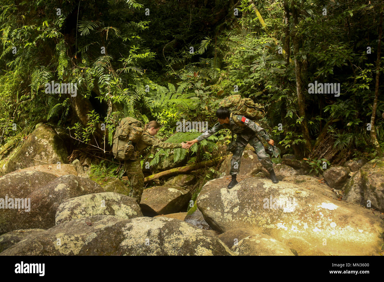 MOUNT BARTLE FRERE, Australia – Corporal Ke Mei Luo, right, a soldier ...