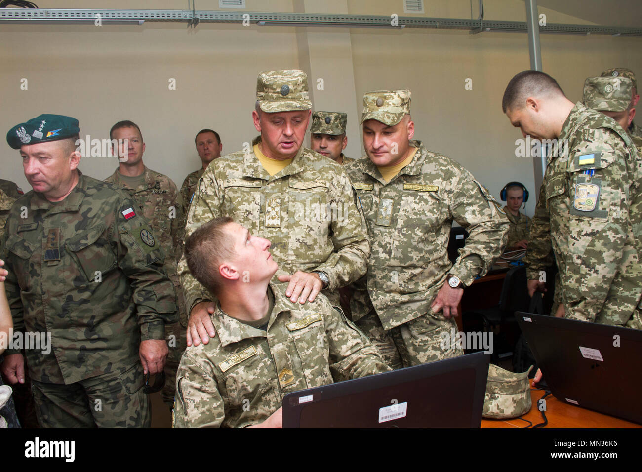 General of the Army of Ukraine Viktor Muzhenko speaks with a Ukrainian ...