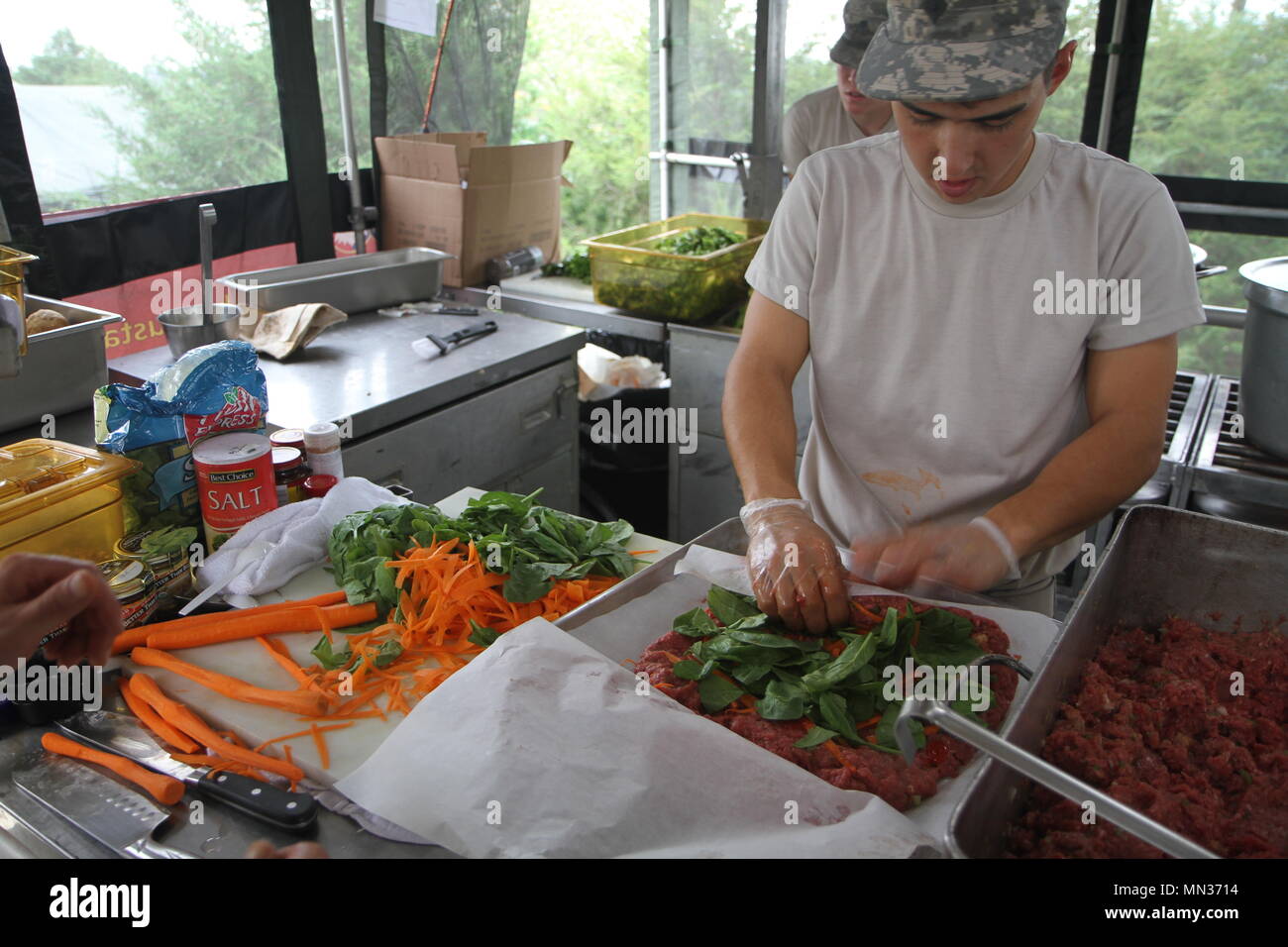 Army Reserve Spc. Jonathan Leeder prepares meatloaf during the U.S ...