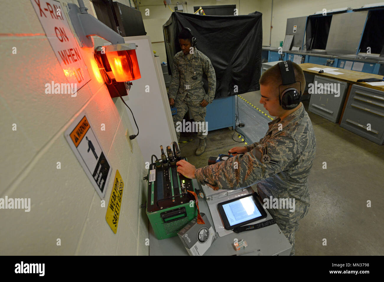 U.S. Air Force Airmen 1st Class Joshua Denis, left, and Cody Emens ...
