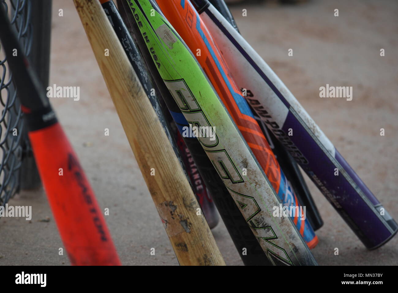 Baseball bats lean against fence hi-res stock photography and images ...