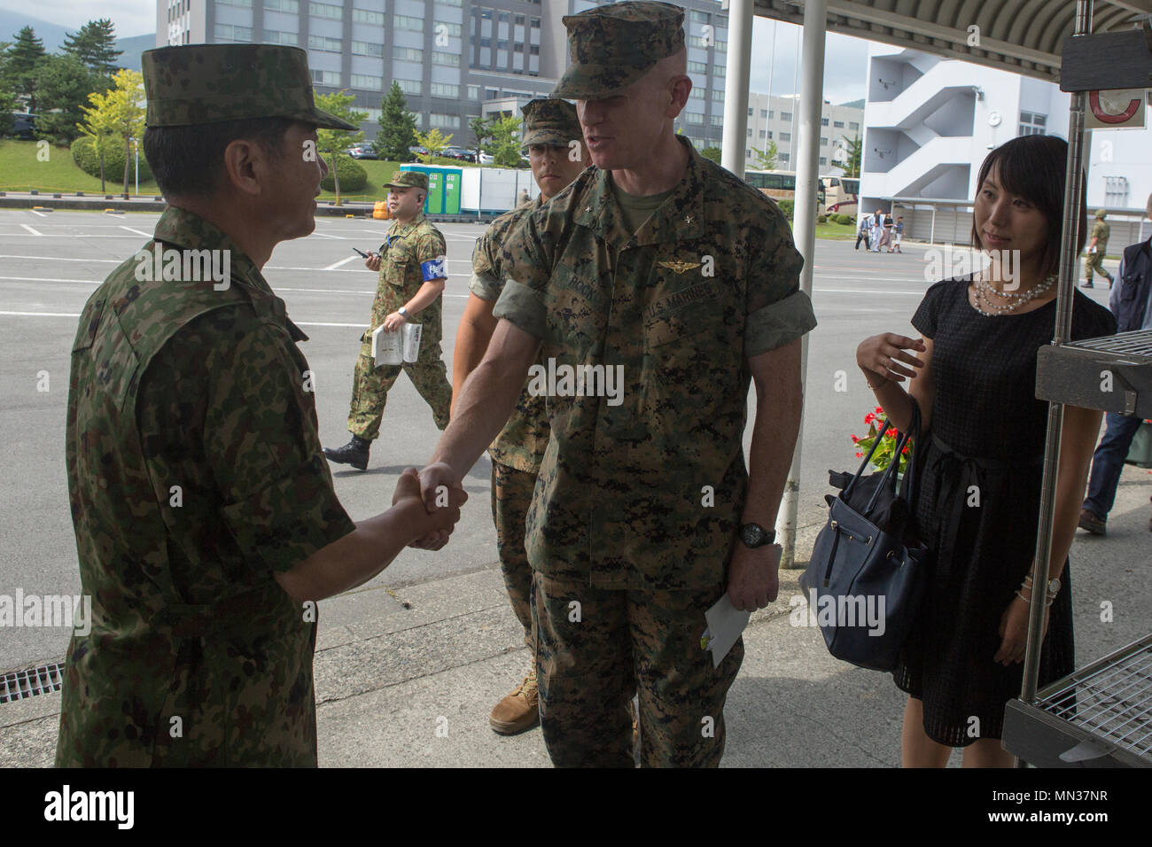 CATC CAMP FUJI, Japan— Chief of Staff Koji Yamazaki, left, shakes hands ...