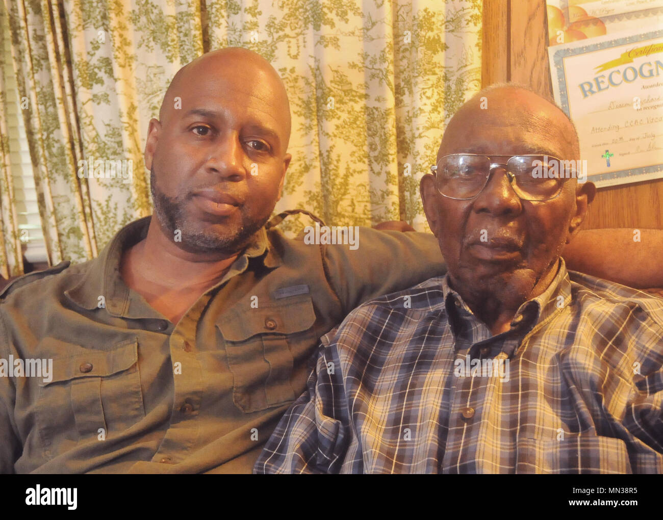 Ben Sessoms Jr. and Richard Bell Jr. sit in the home of Bell Aug. 24 ...