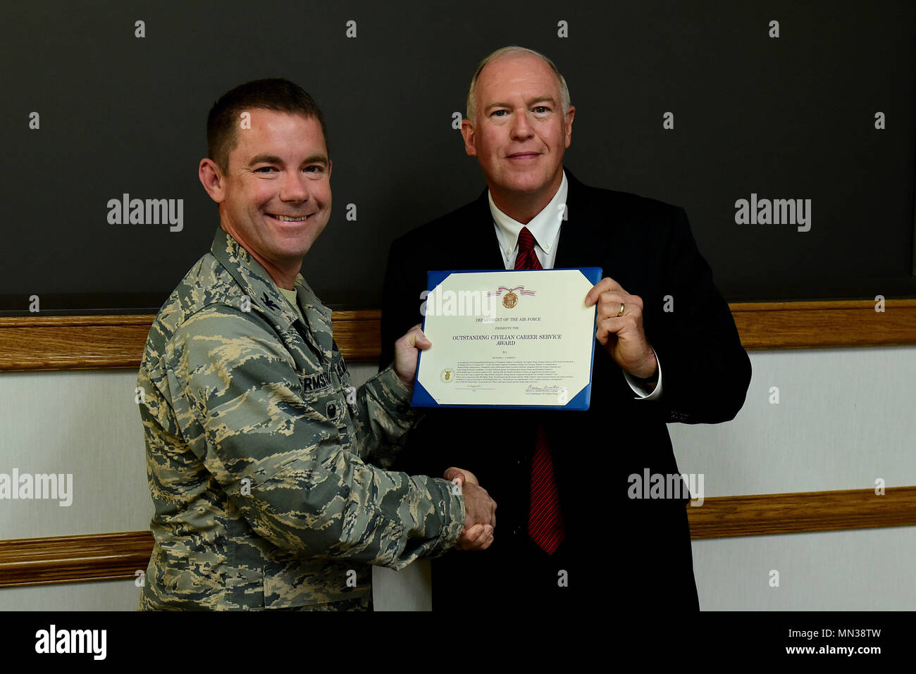 Col. Brian Armstrong, 4th Fighter Wing vice commander, presents the ...