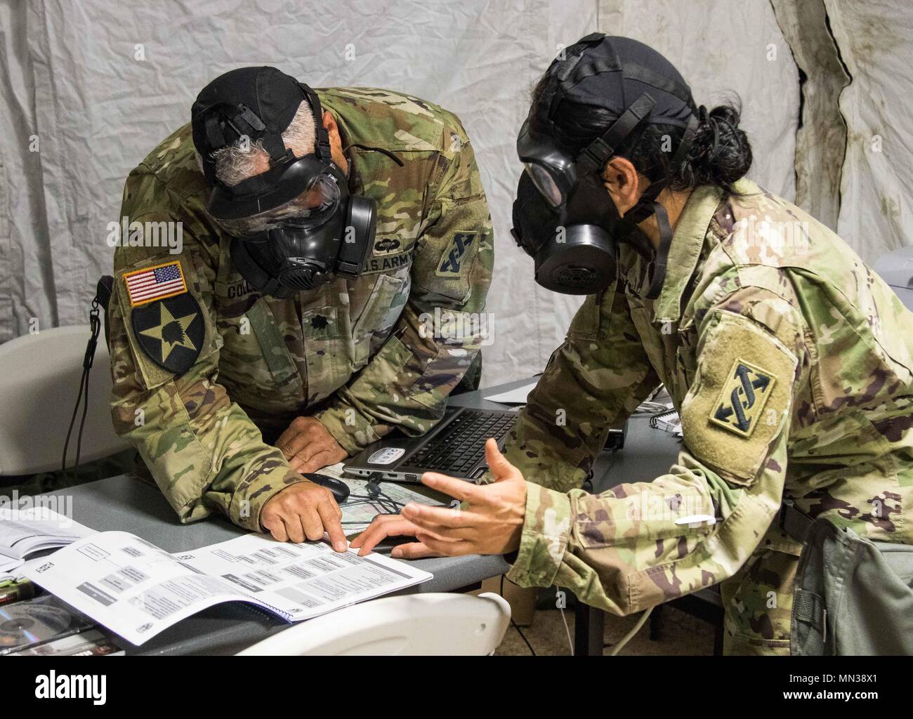 While wearing protective masks, Soldiers from the Headquarters and ...