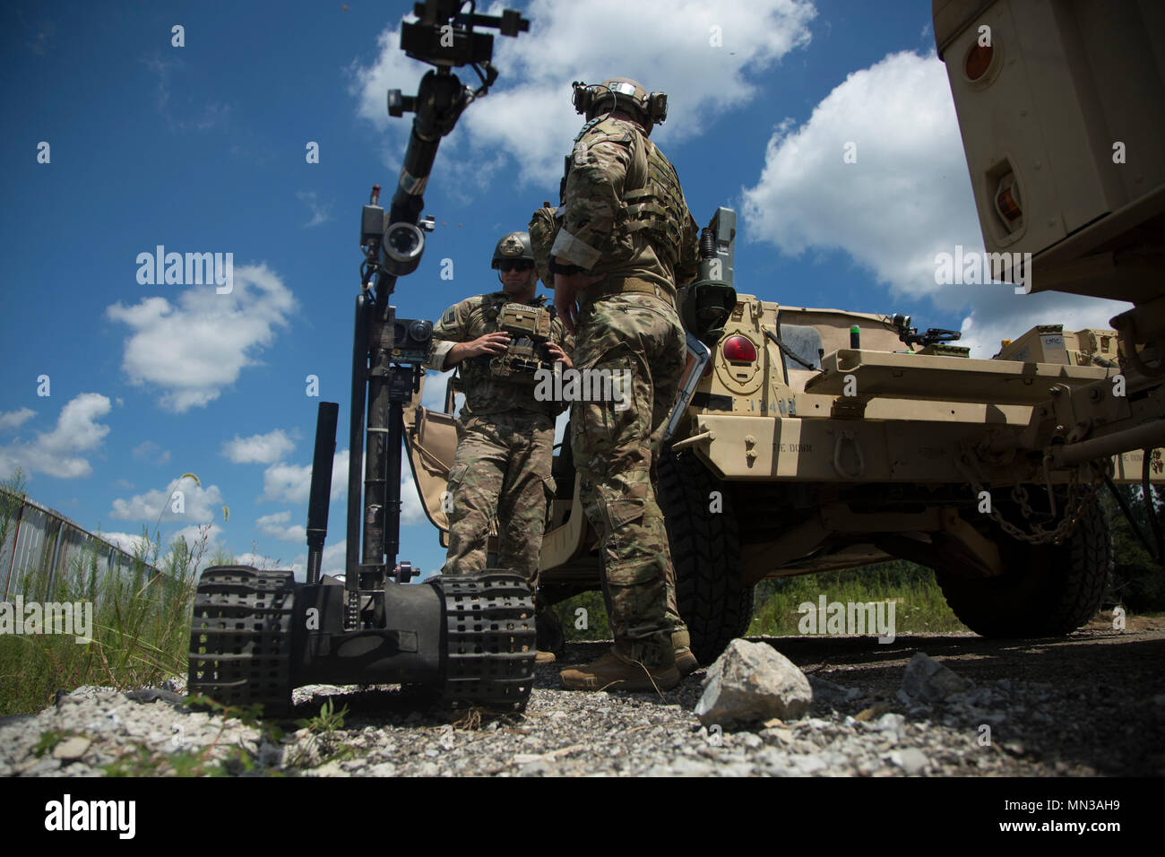 U.S. Army Spc. Andrew Brotherton (left) and Staff Sgt. Eric Fitzgerald ...