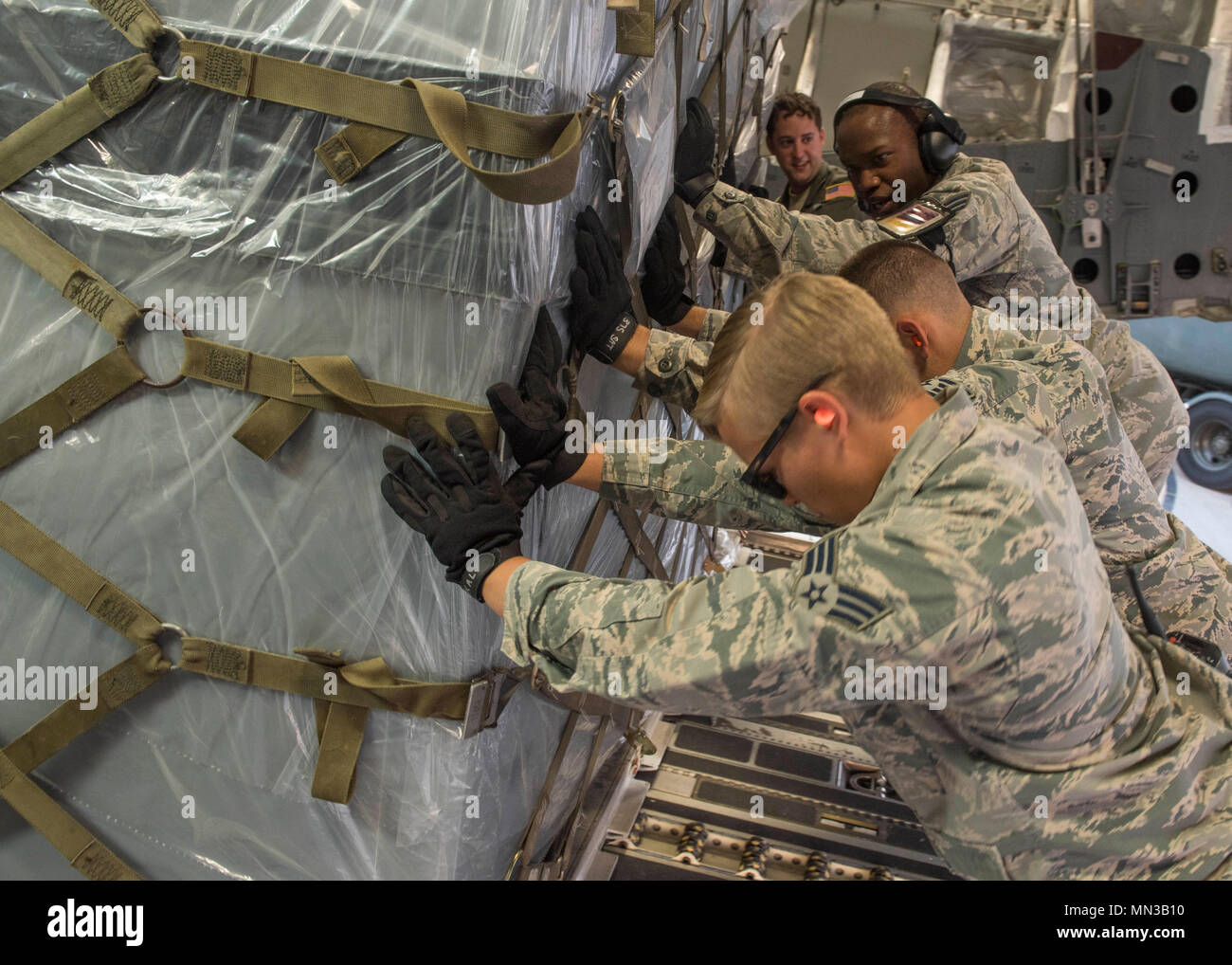 Members of the 375th Logistics Readiness Squadron load disaster relief ...