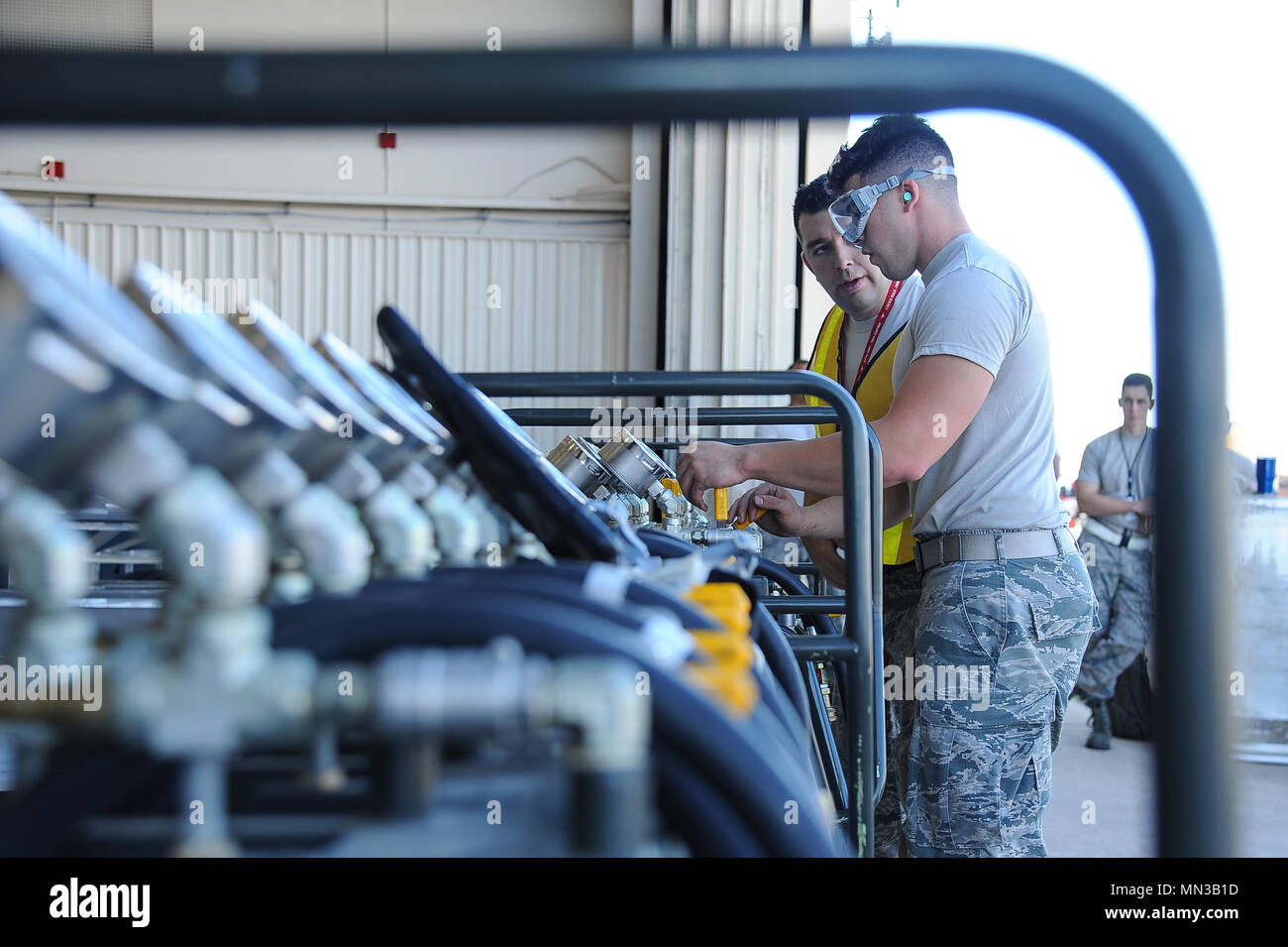 U.S. Air Force Tech. Sgt. Bryen Sandoval and Airman 1st Class Reed ...