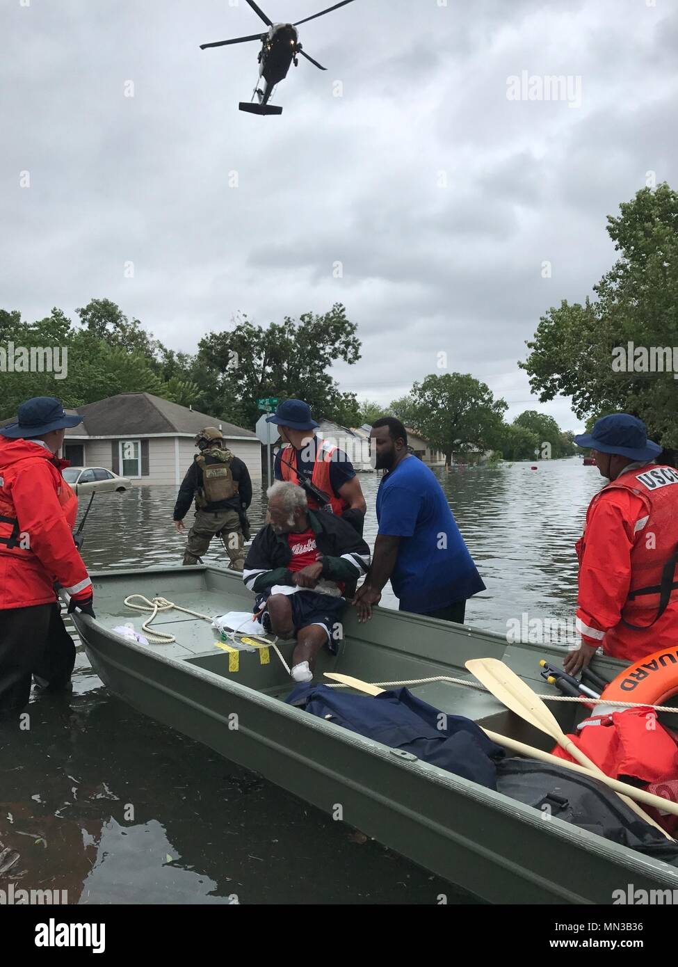 U.S. Coast Guard Atlantic Strike Team members search house to house in ...