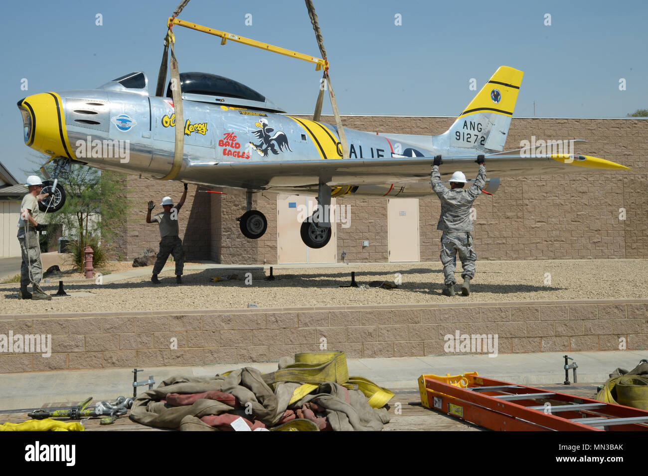 Airmen assigned to the 144th Maintenance Squadron align the F-86A Sabre ...