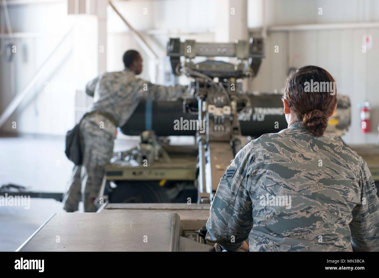 U.S Air Force Staff Sgt. Lamarcus Brown, left, 7th Maintenance Group ...