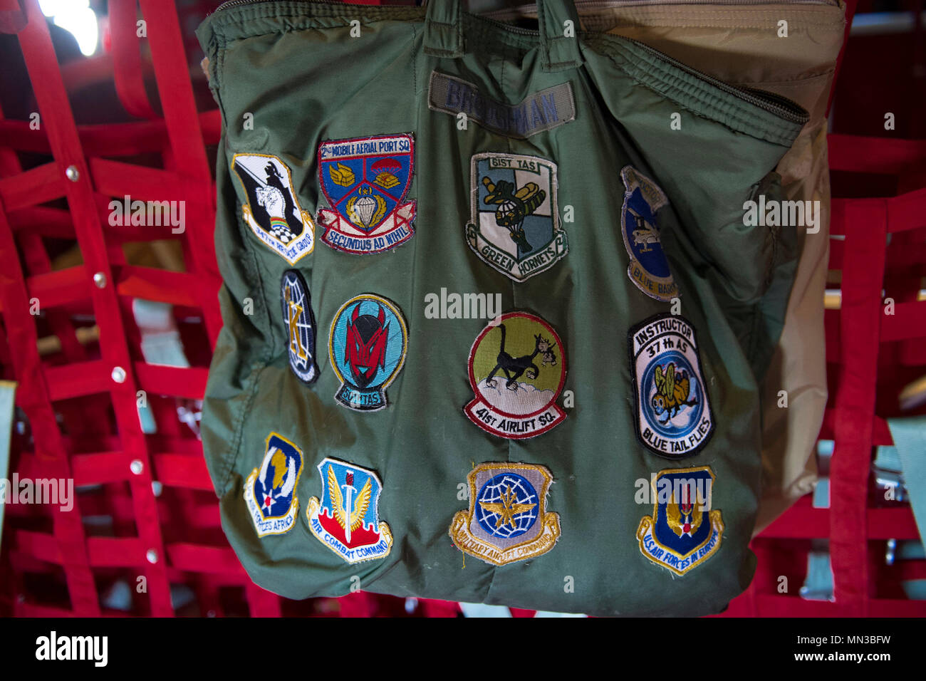 A bag donning patches of the different units Chief Master Sgt. Brandon ...