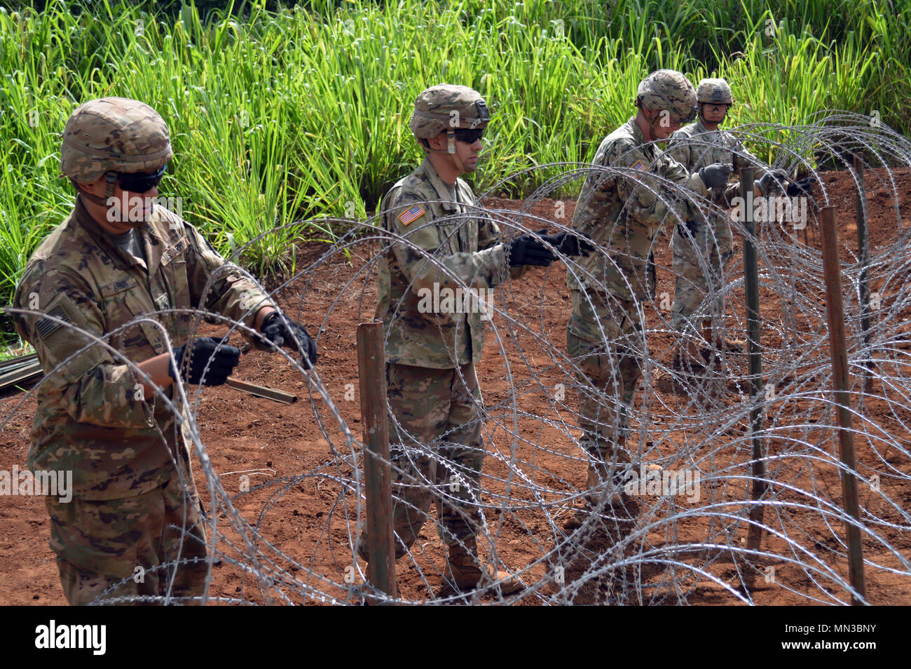 Triple strand concertina wire hi-res stock photography and images - Alamy