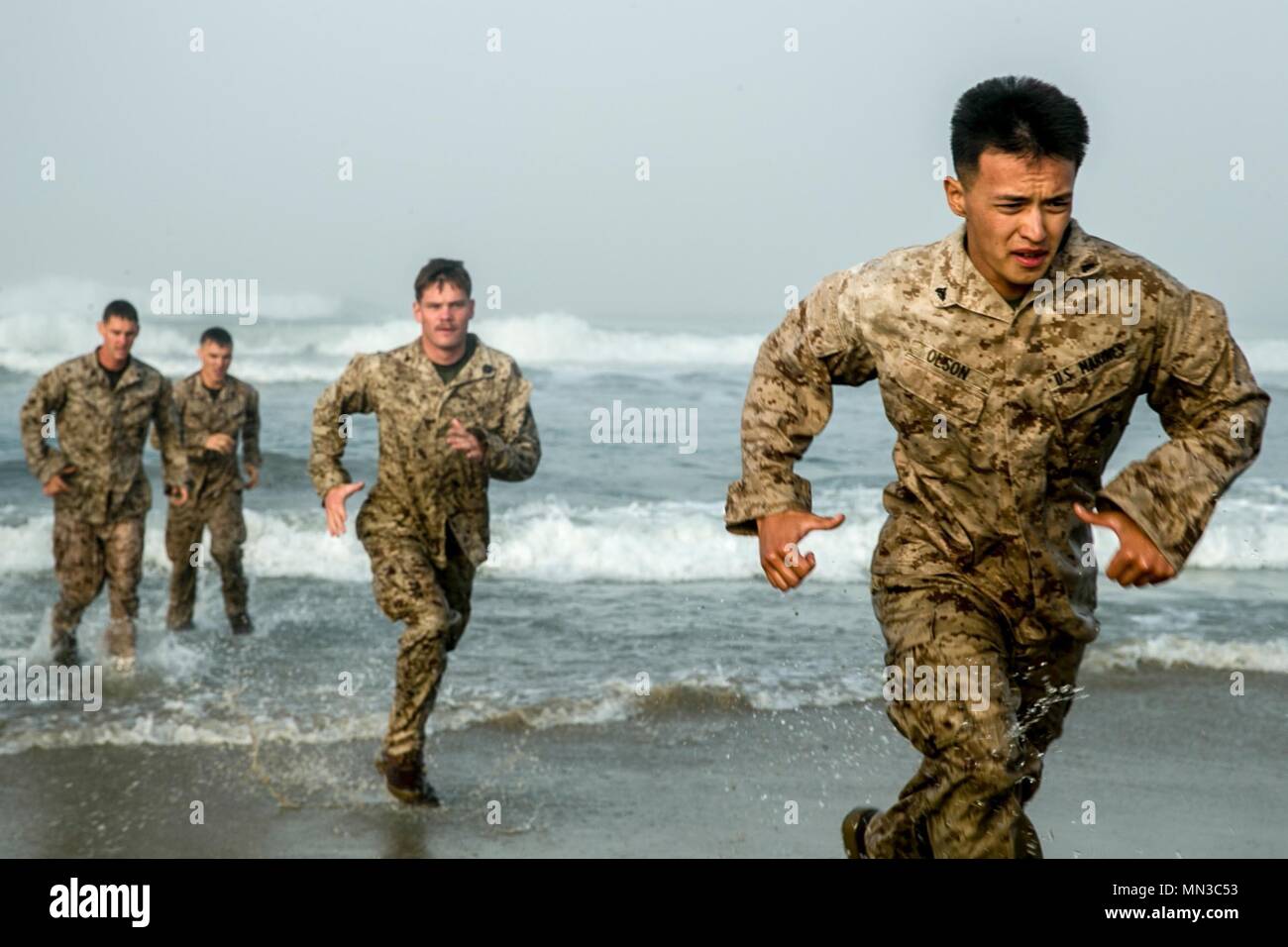 U.S. Marines with 2nd Battalion, 1st Marine Regiment, run out of the ...