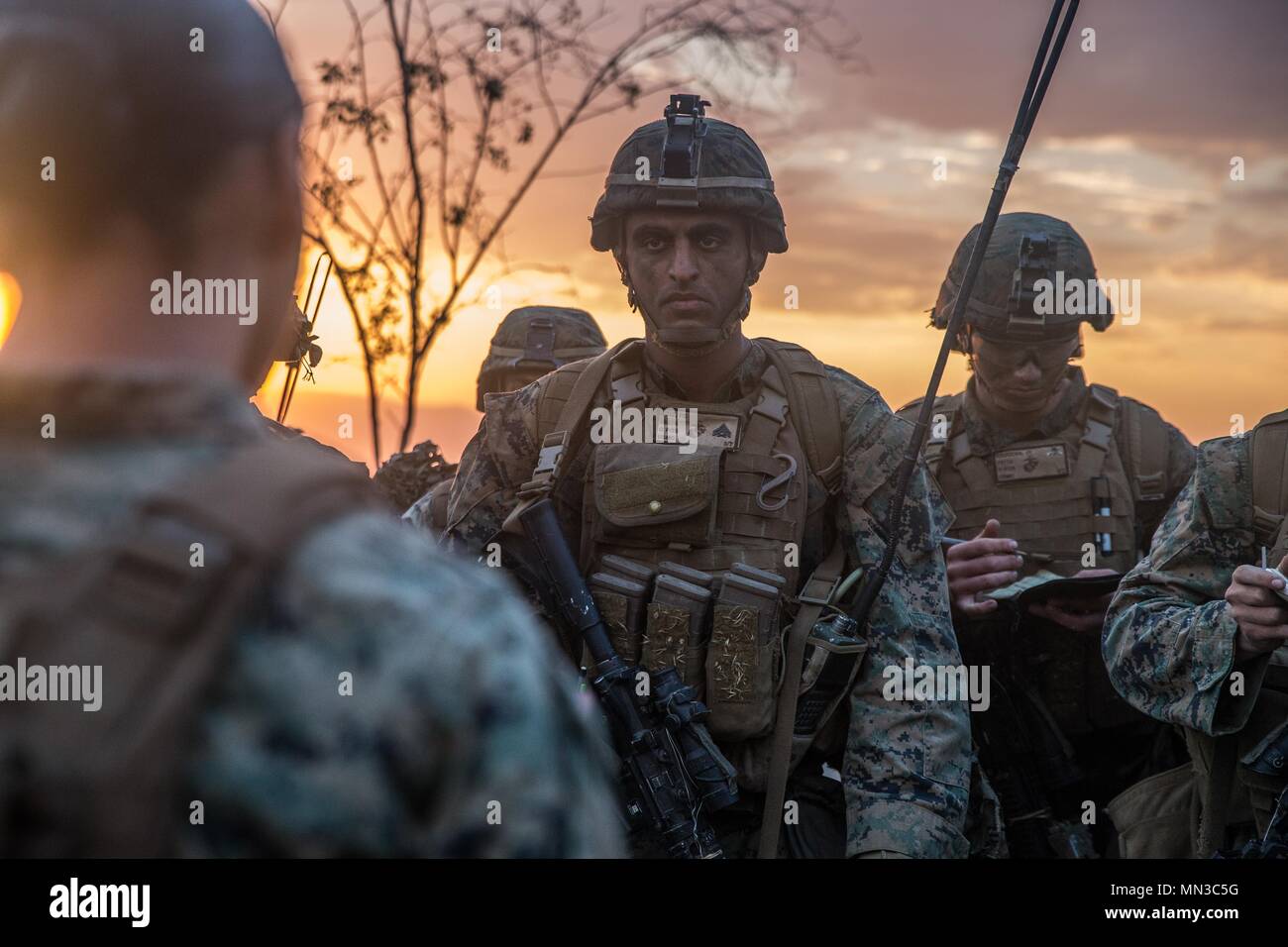 U.S. Marines with 3rd Battalion, 7th Marine Regiment receive an ambush ...