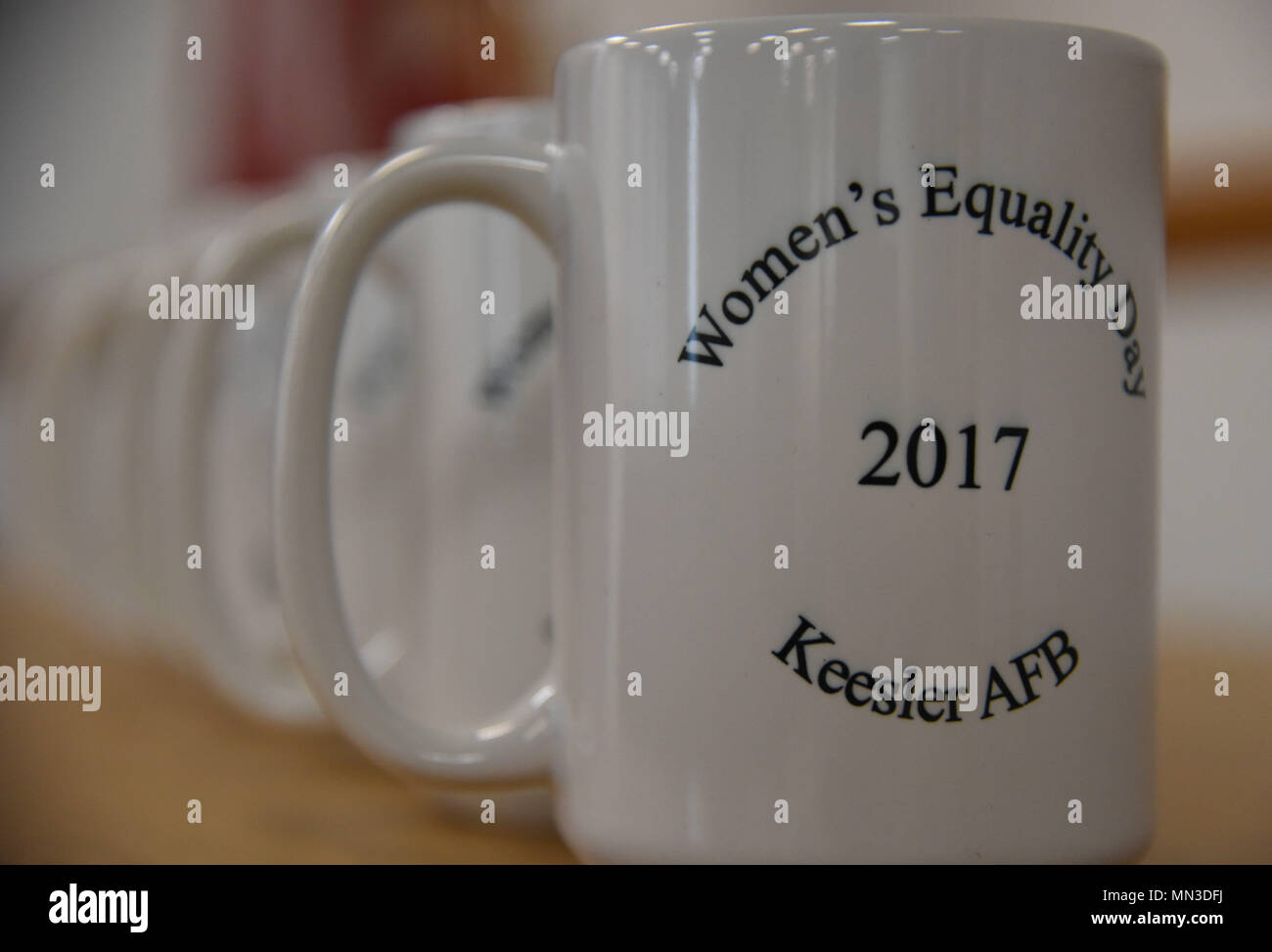 Coffee cups sit on display at the Women’s Equality Day Celebration ...