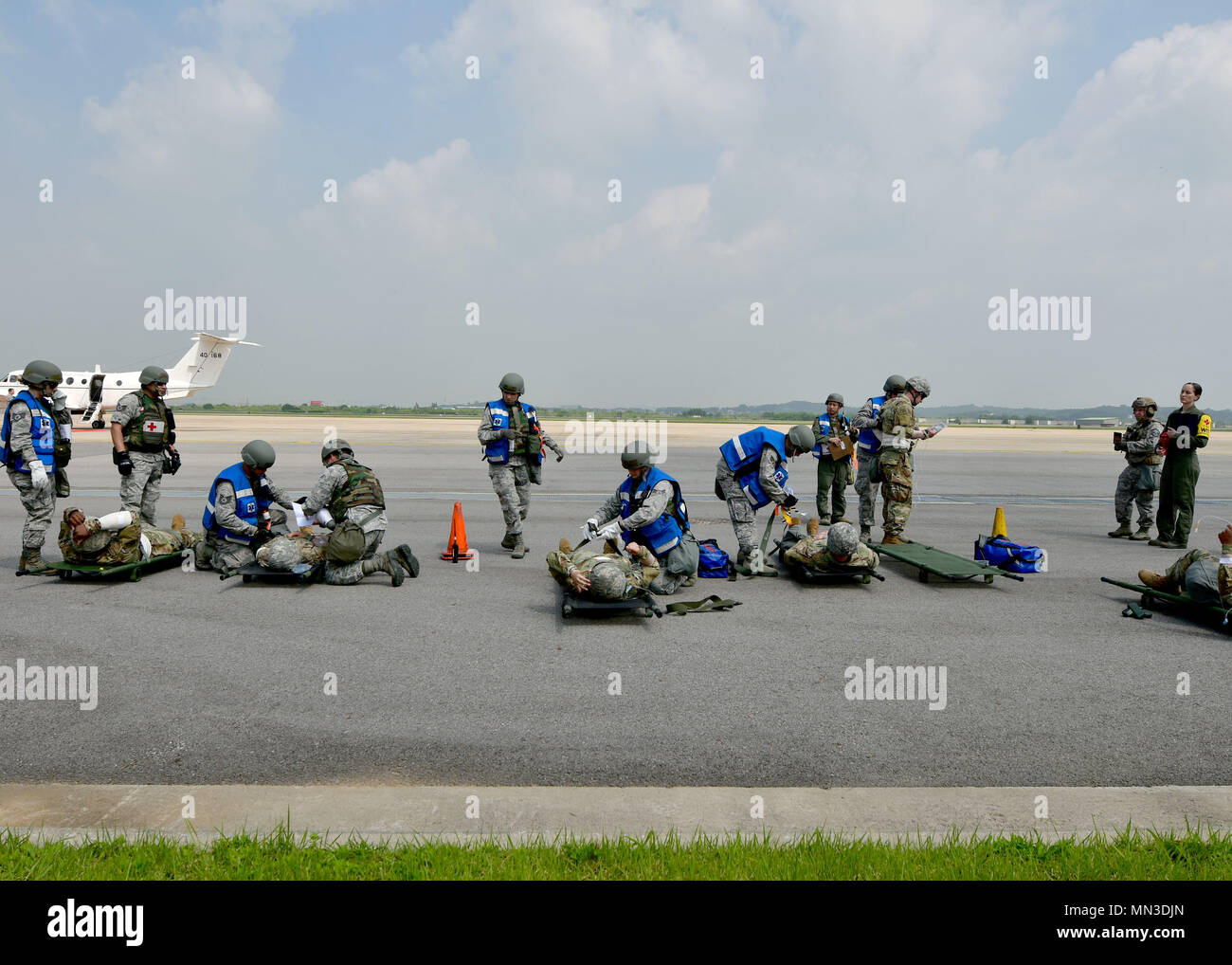 Members from the 51st Medical Group Field Response Team, treat U.S ...