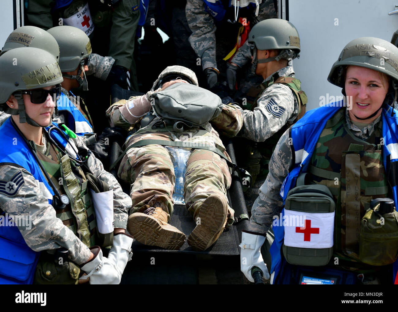 Members from the 51st Medical Group Field Response Team, unload a U.S ...