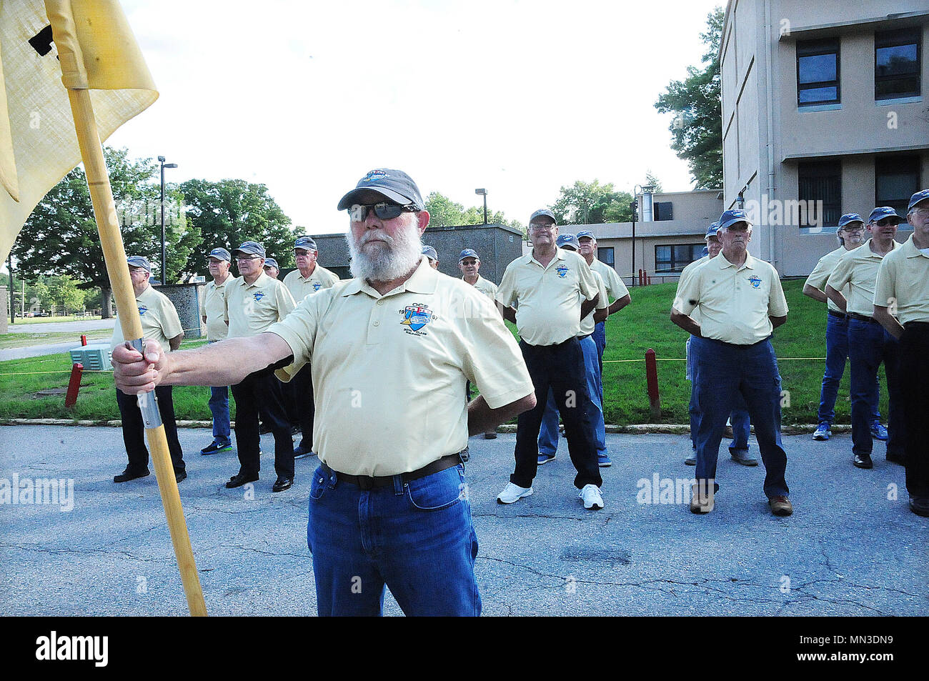Jerry Wile, guidon bearer, and his fellow Class 67-13 classmates stand ...