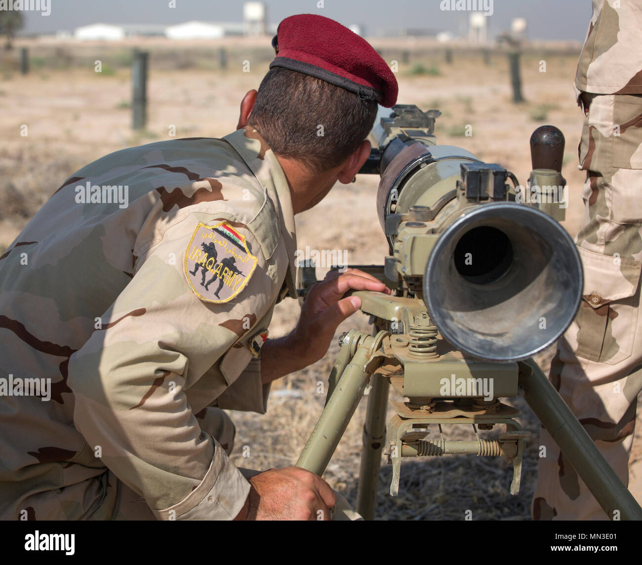 An Iraqi army soldier looks down a scope of a recoilless rifle during ...