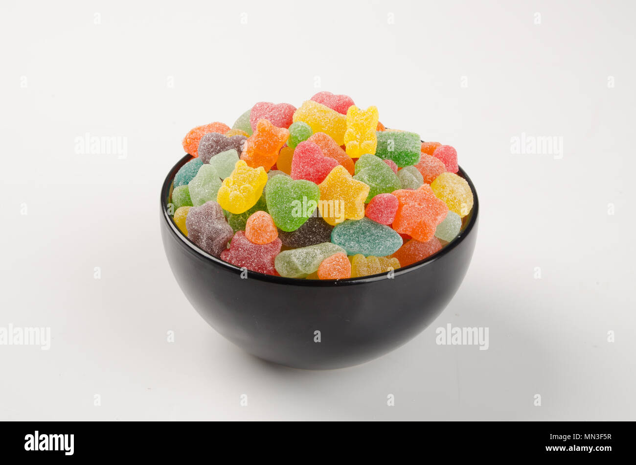 gummy candies in bowl or jelly candies on background Stock Photo - Alamy