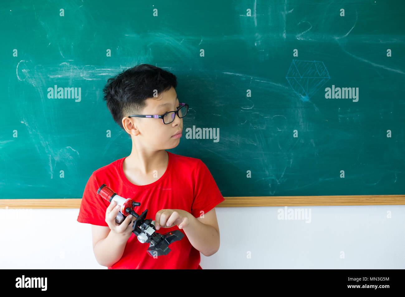Little students holding ad study science in the classroom Stock Photo ...