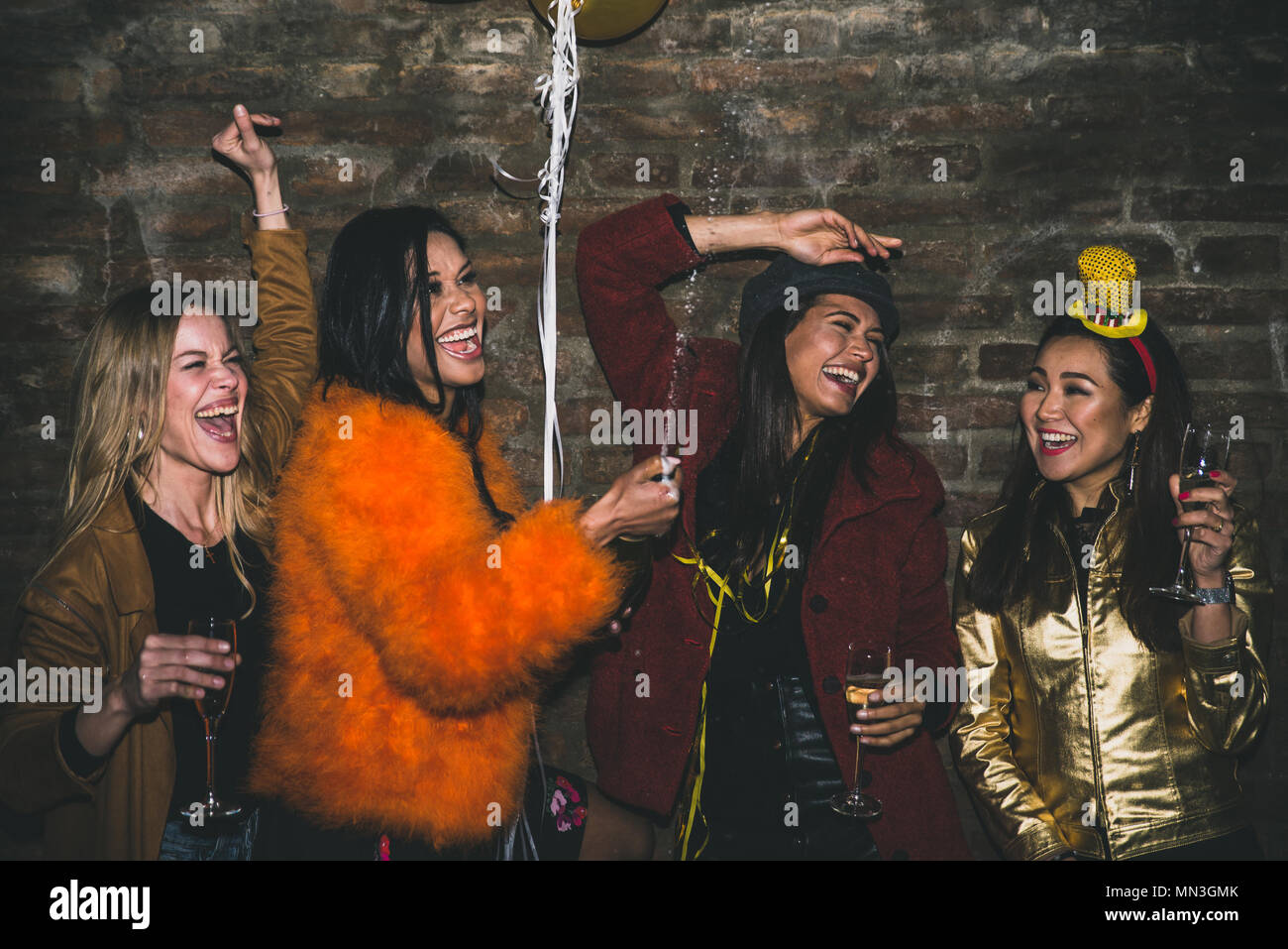 Group of girls celebrating and having fun the club. Concept about women ...