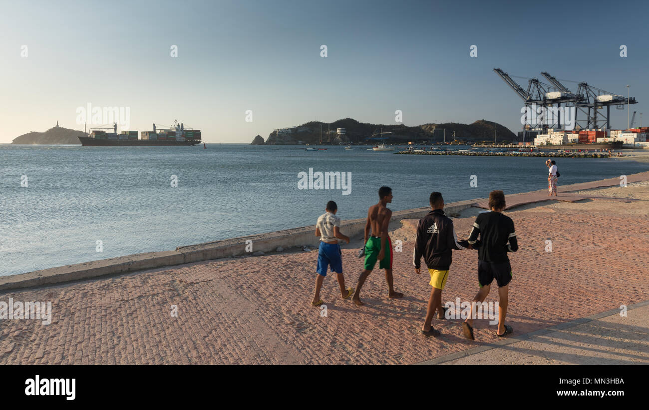 The Malecon (waterfront) and port with an inbound container ship, Santa ...