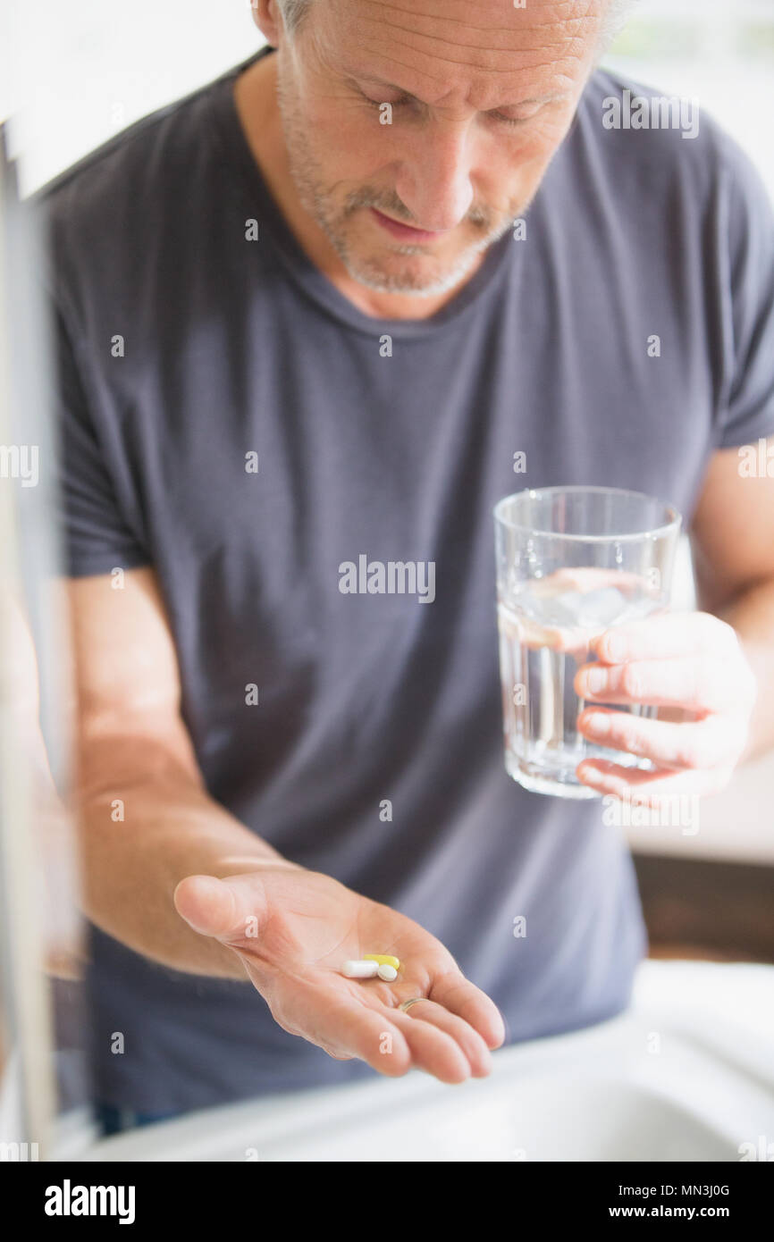 Taking vitamins hi-res stock photography and images - Alamy