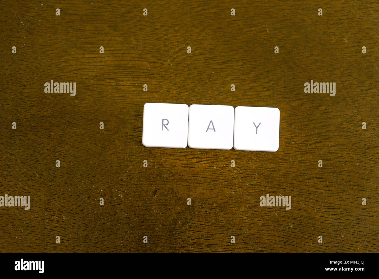 RAY word written on plastic keyboard alphabet with dark background ...