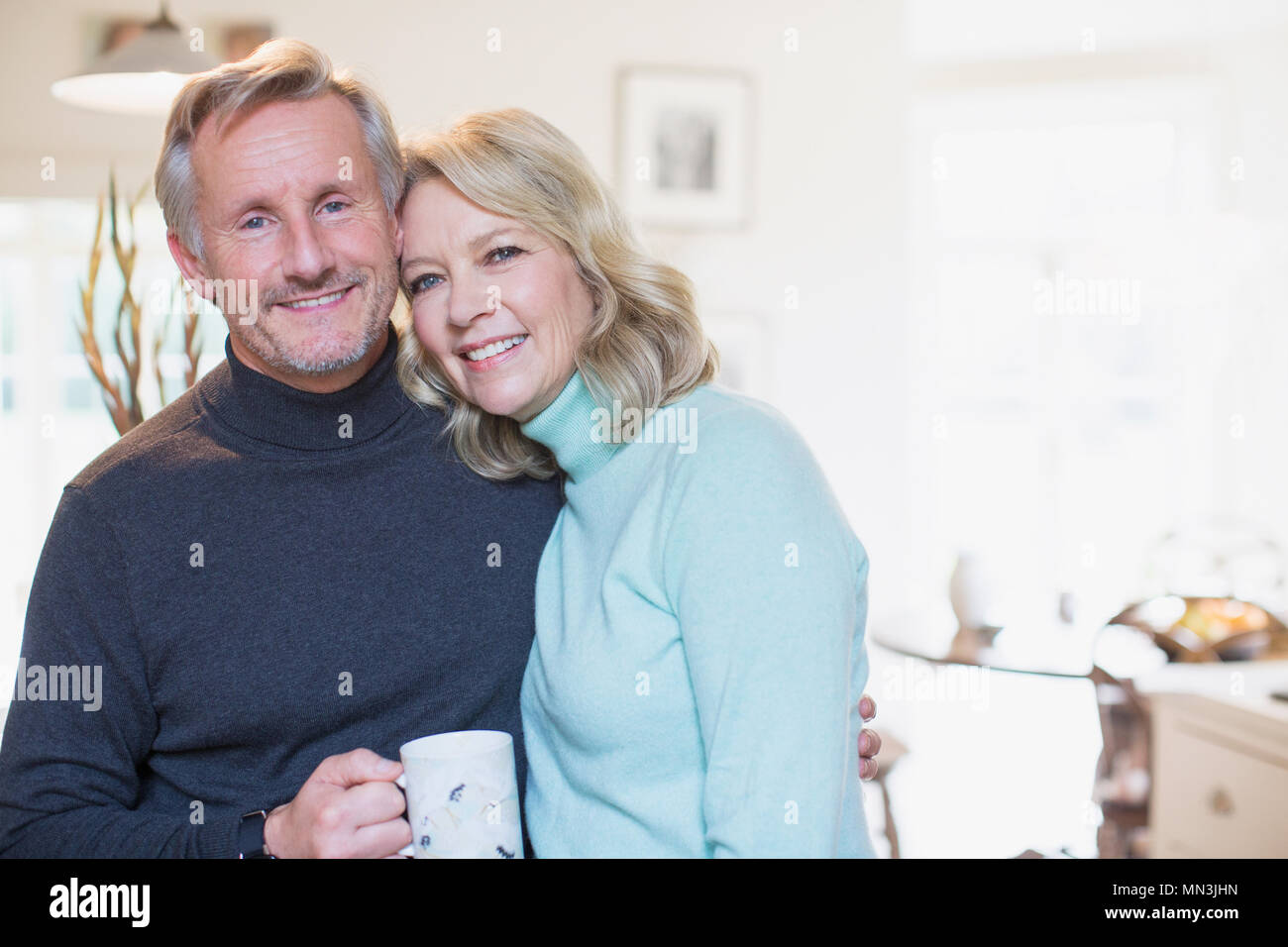 Portrait smiling, confident mature couple Stock Photo - Alamy