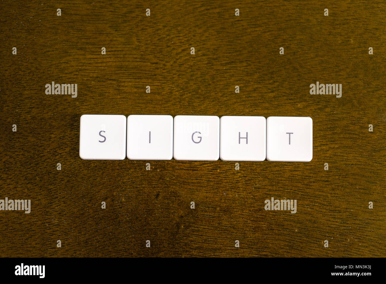 SIGHT word written on plastic keyboard alphabet with dark background ...