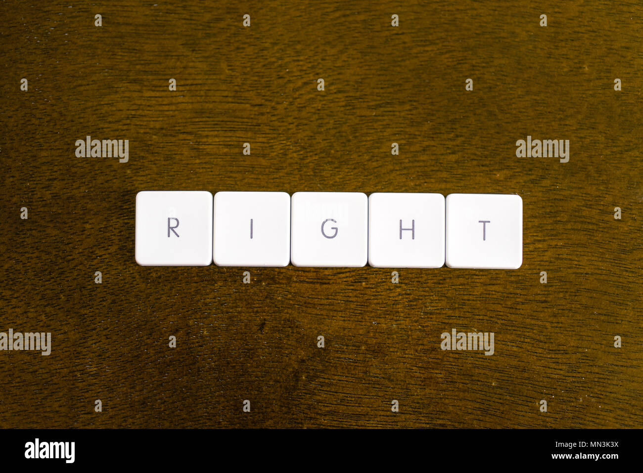 RIGHT word written on plastic keyboard alphabet with dark background ...
