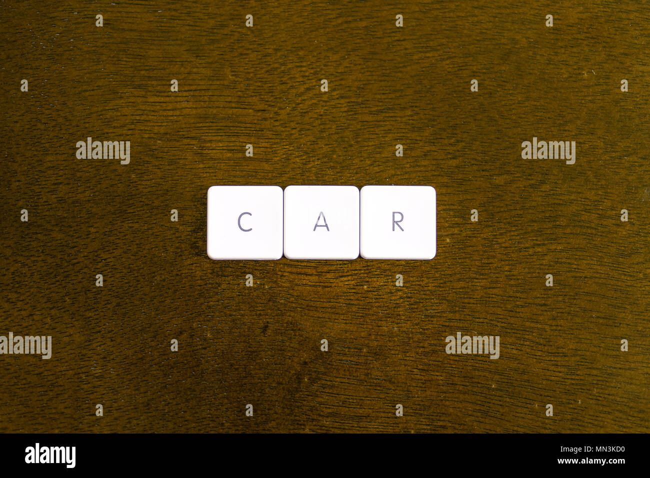 CAR word written on plastic keyboard alphabet with dark background ...