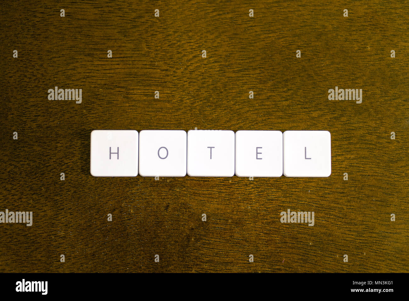 HOTEL word written on plastic keyboard alphabet with dark background ...