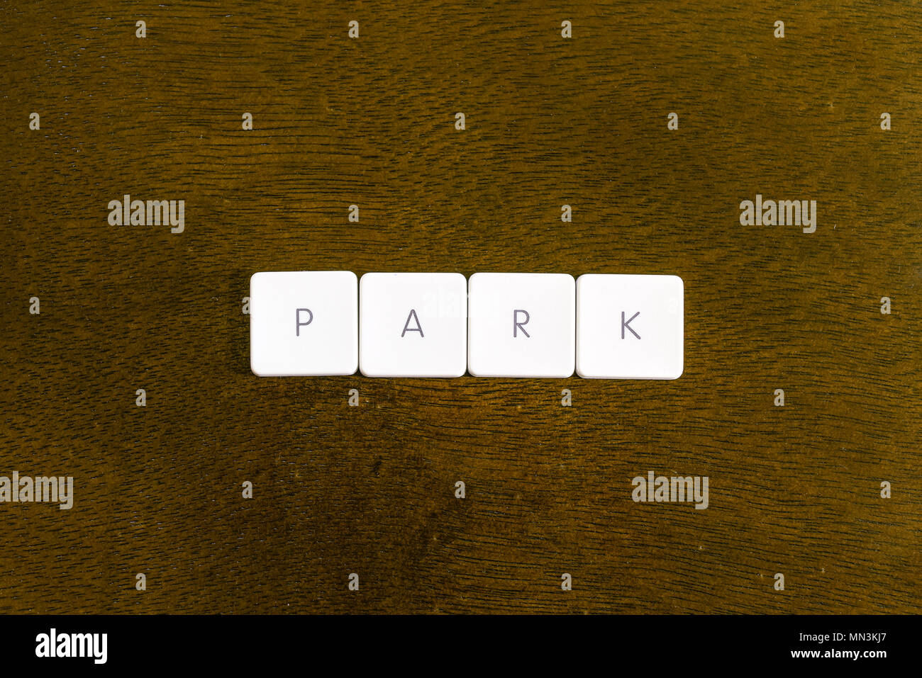 PARK word written on plastic keyboard alphabet with dark background ...