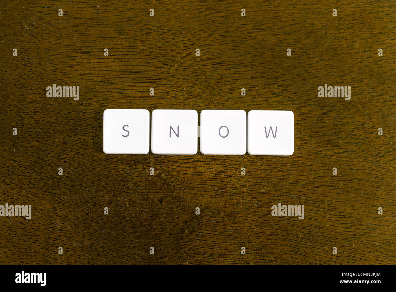 SNOW word written on plastic keyboard alphabet with dark background ...