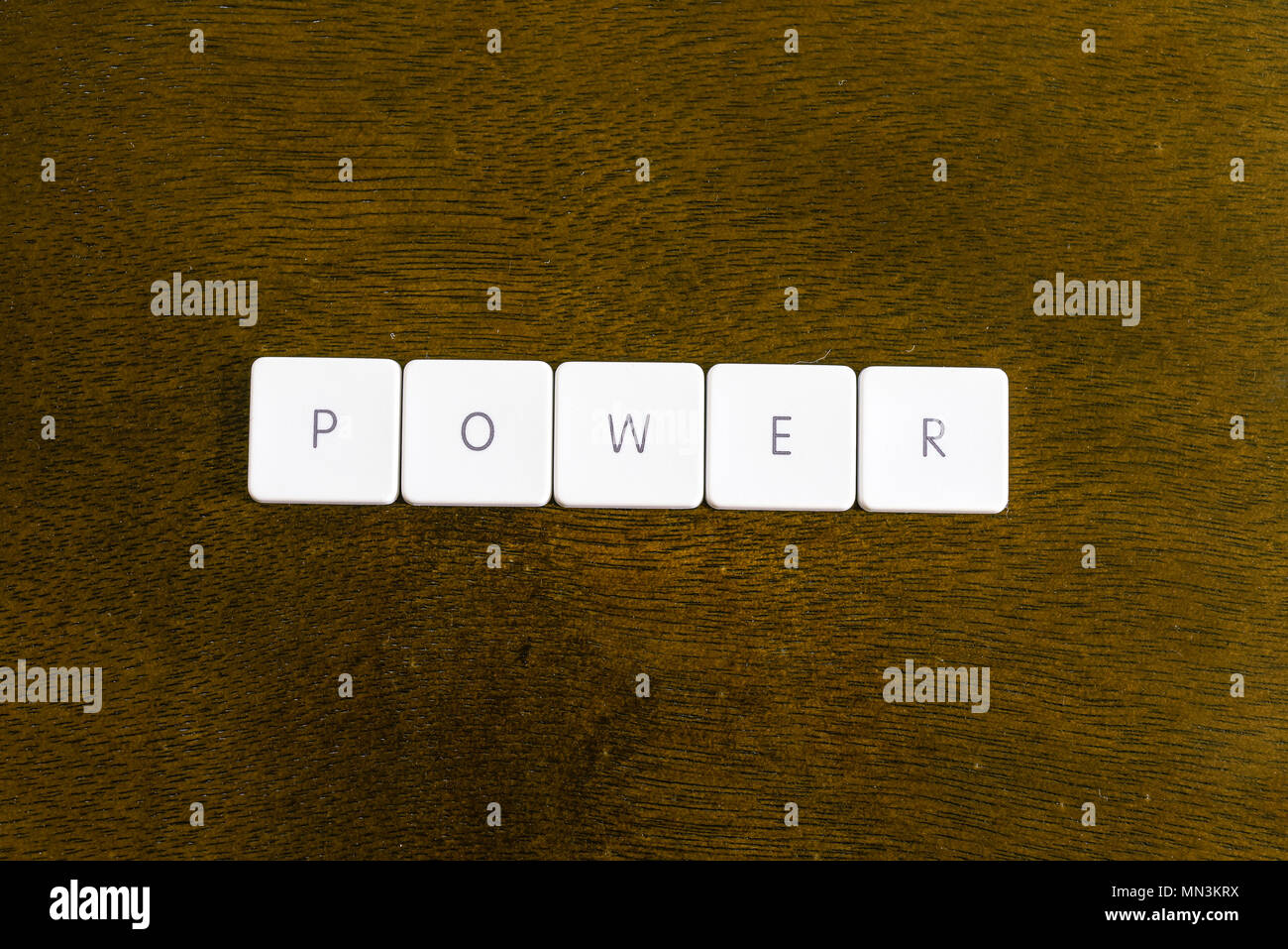 POWER word written on plastic keyboard alphabet with dark background ...