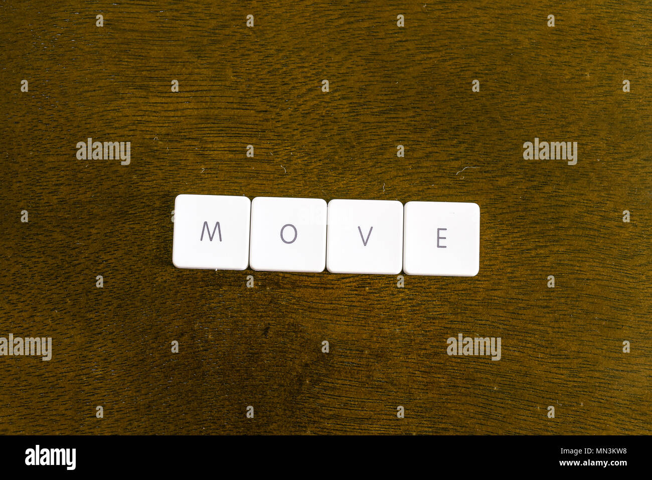 MOVE word written on plastic keyboard alphabet with dark background ...