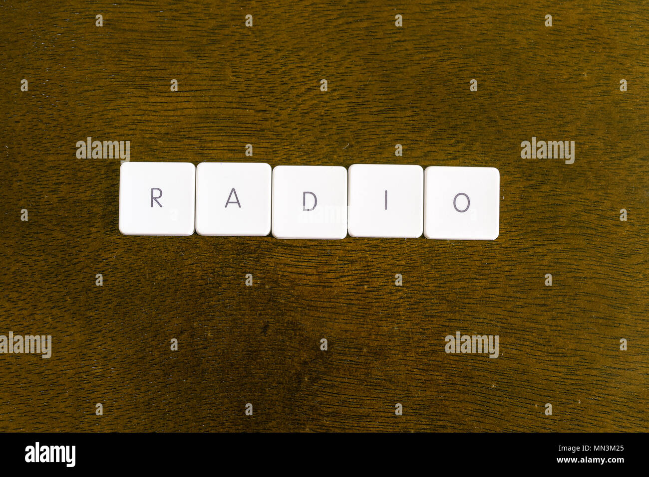 RADIO word written on plastic keyboard alphabet with dark background ...