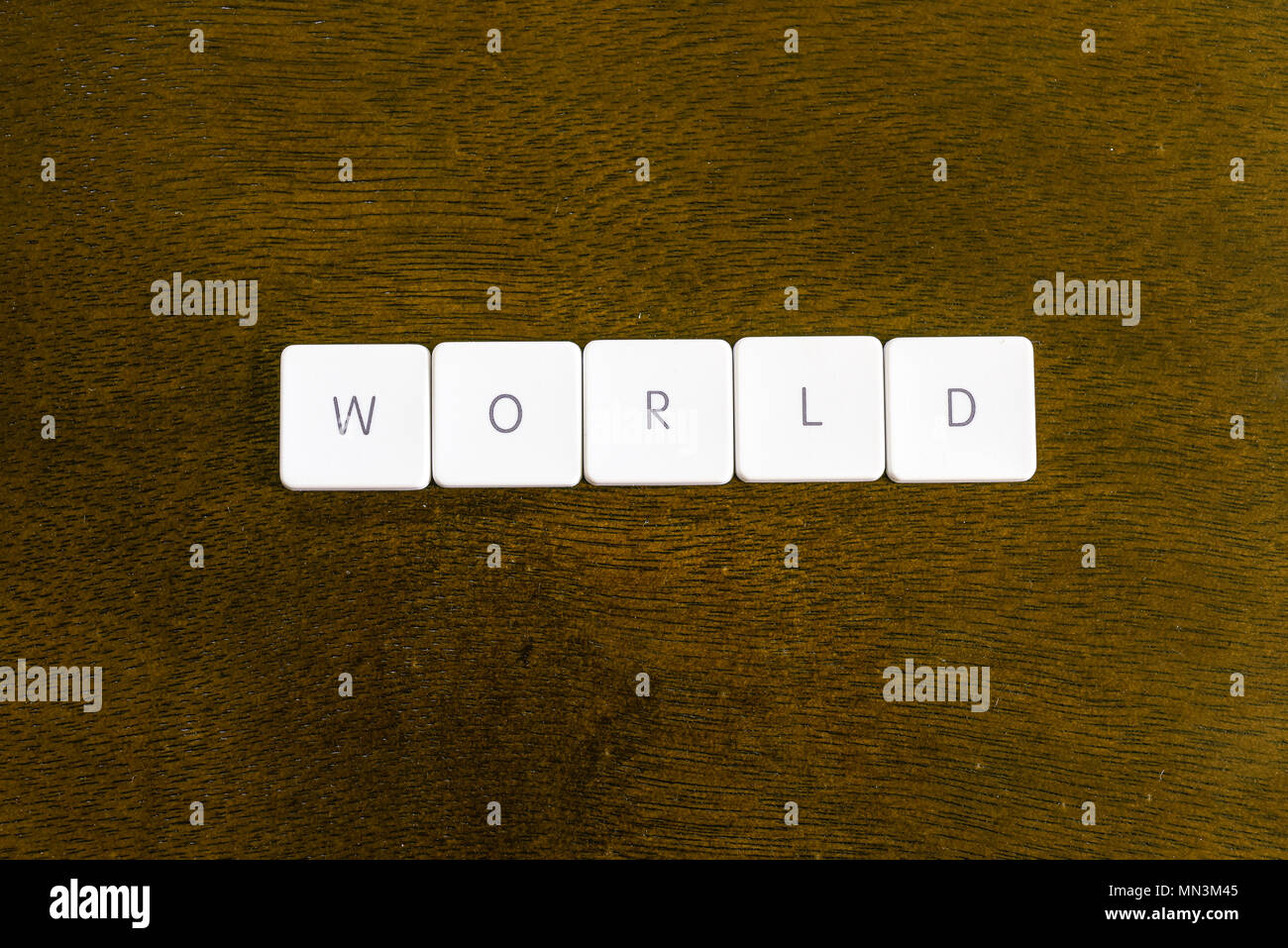 WORLD word written on plastic keyboard alphabet with dark background ...