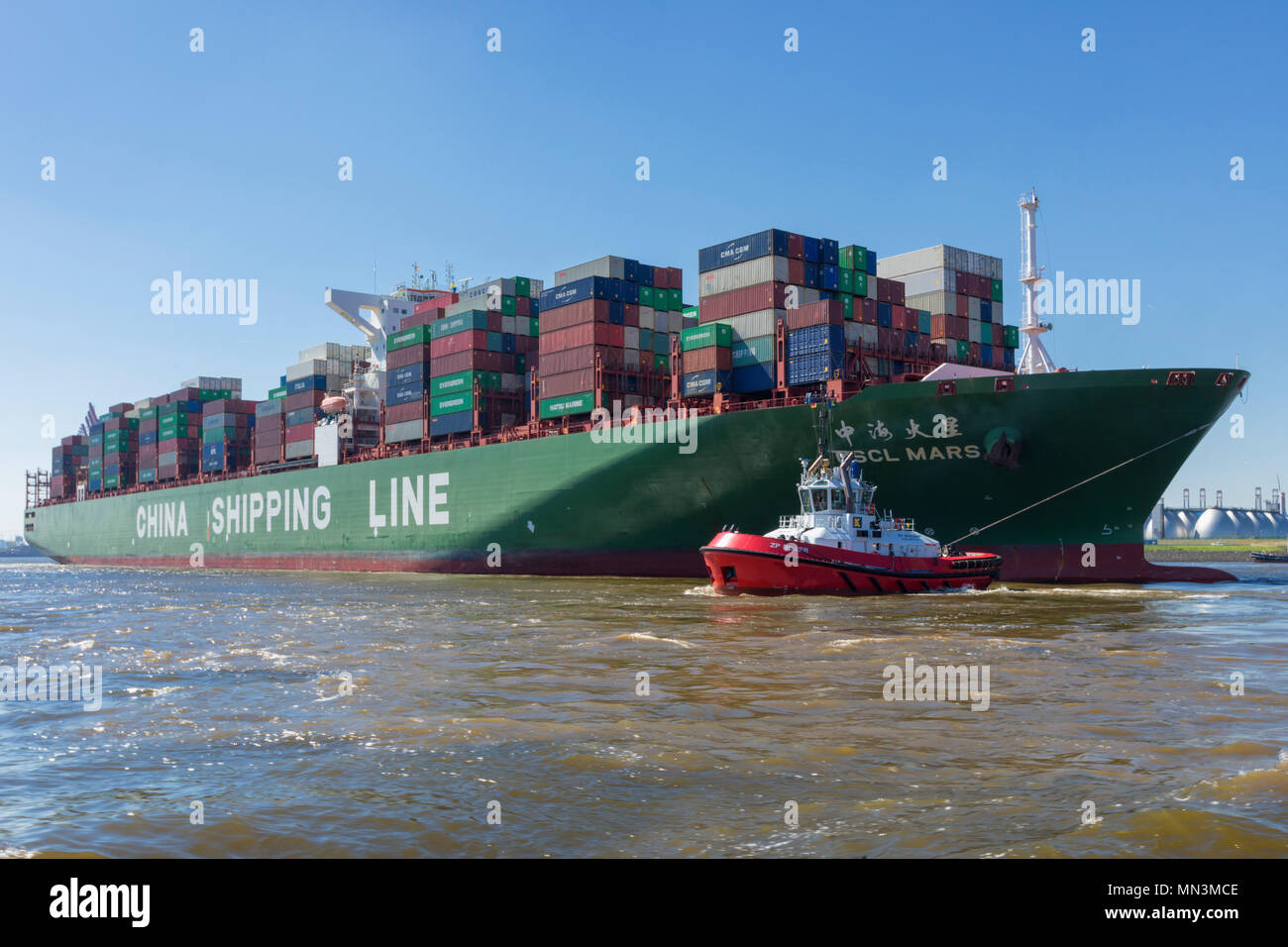 Tug boat ZP BOXER maneuvering container vessel CSCL MARS to its berth ...