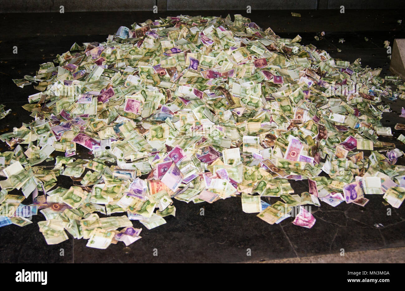A pile of Chinese currency intended as ‘offerings to the gods’, in the ...