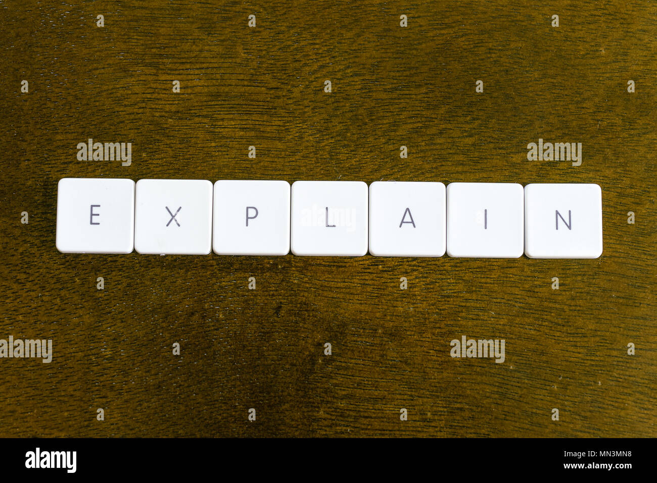 EXPLAIN word written on plastic keyboard alphabet with dark background ...