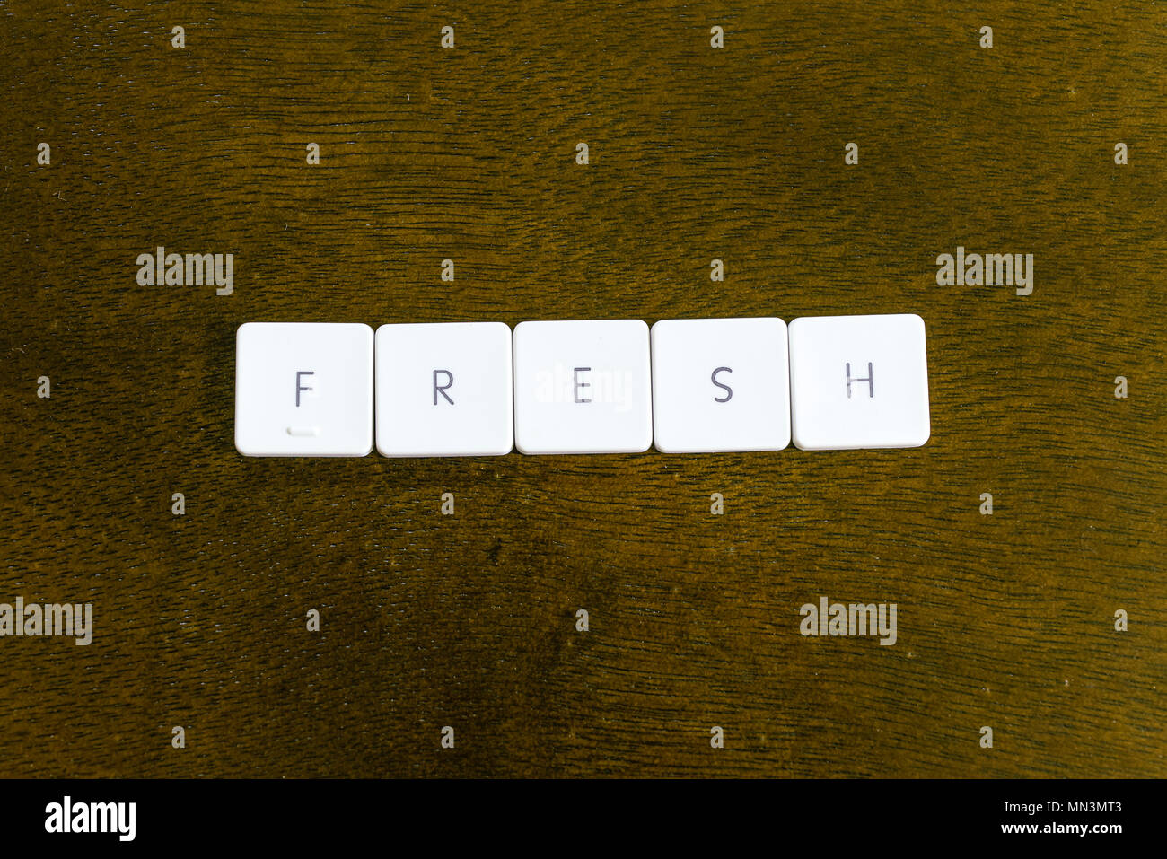 FRESH word written on plastic keyboard alphabet with dark background ...