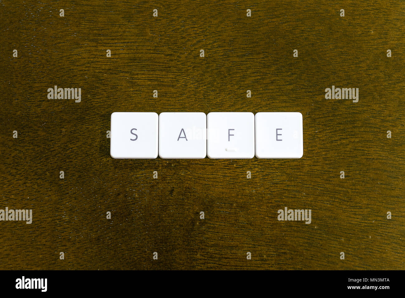 SAFE word written on plastic keyboard alphabet with dark background ...