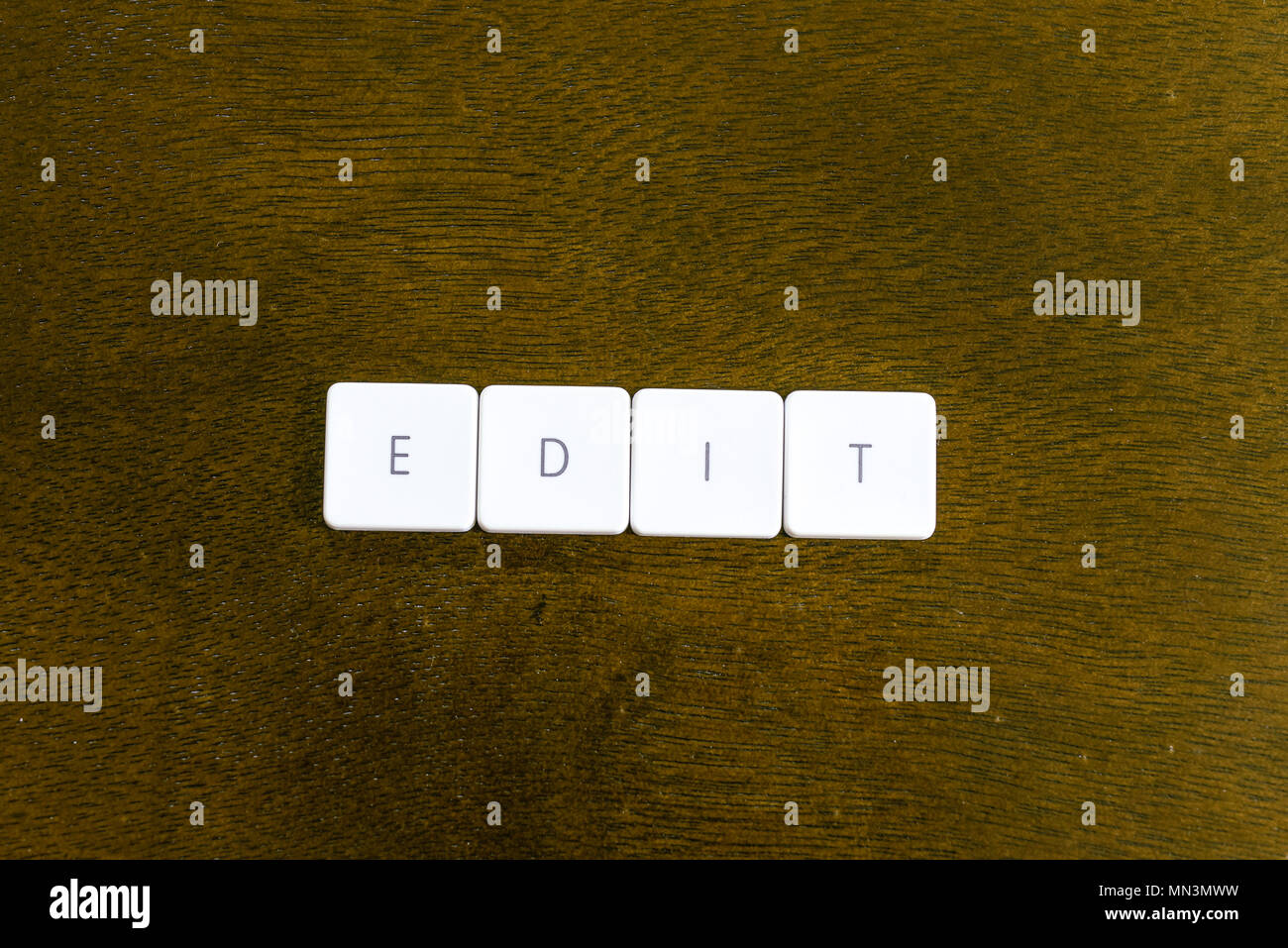 EDIT word written on plastic keyboard alphabet with dark background ...