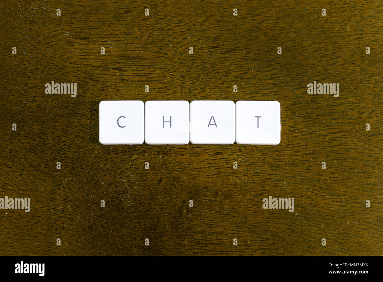 CHAT word written on plastic keyboard alphabet with dark background ...